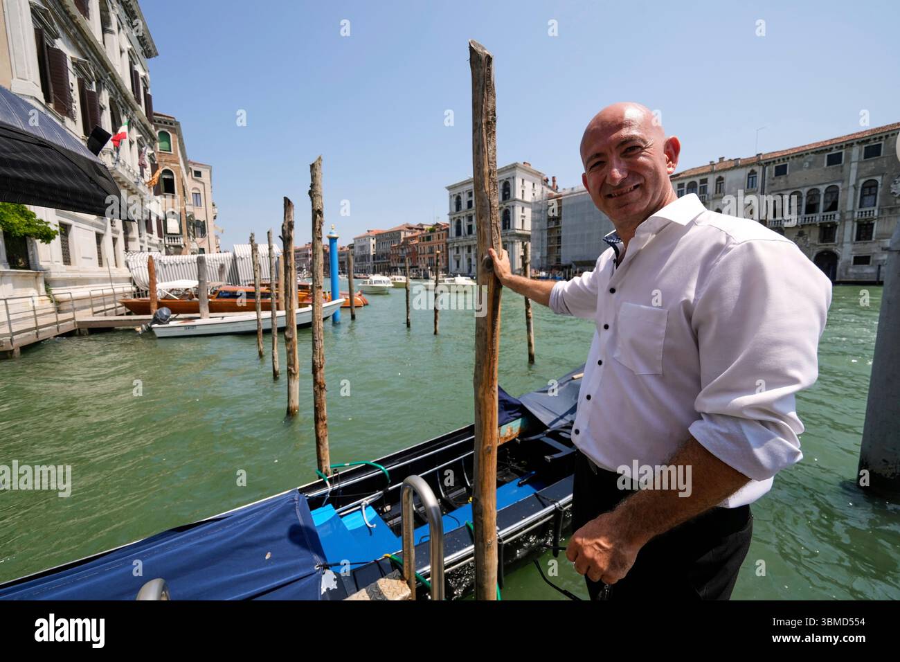 A lookalike of Amazon founder Jeff Bezos poses for photos in Venice ...