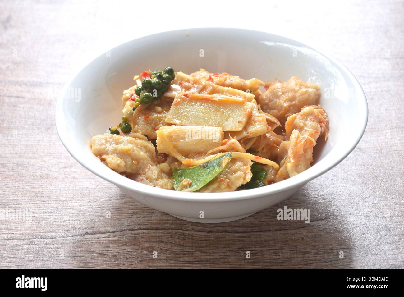 spicy fried slice fresh coconut shoot with grouper fish ball in curry ...