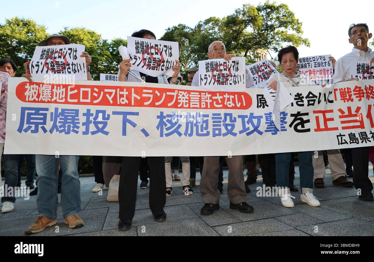 Survivors of the atomic bomb protest in front of the Atomic Bomb Dome ...