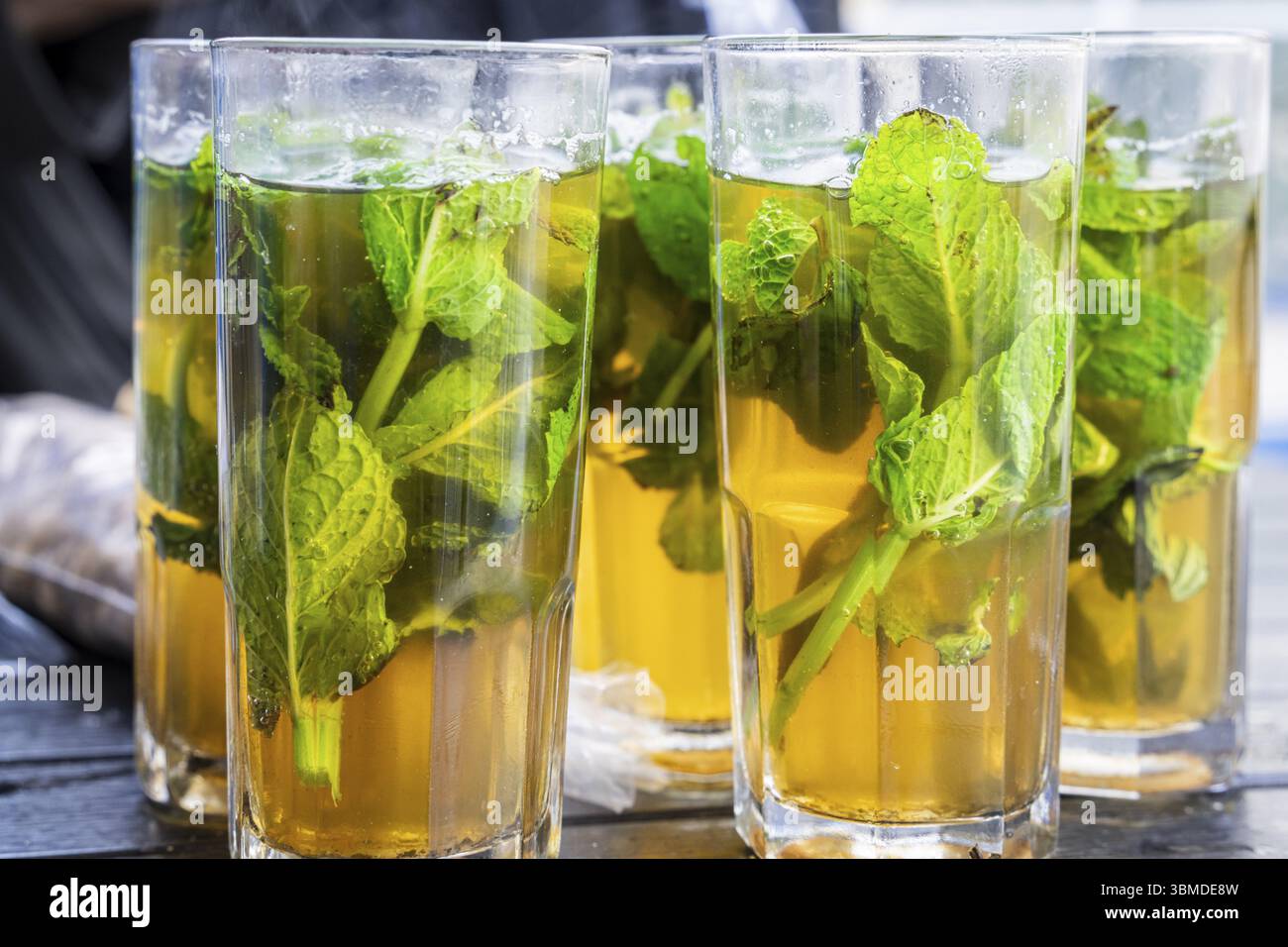 Glasses of mint tea with fresh leaves, Ibn Khaldoun Square, Asilah ...