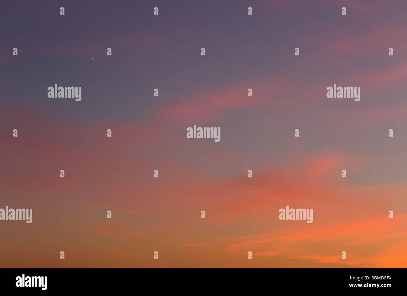 Open view to melancholic and nostalgic sunset sky with suggestive pink ...