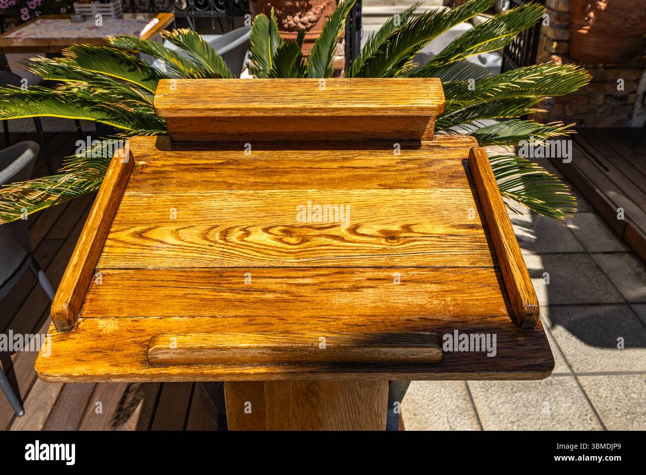A wooden platform placed in front of a restaurant, a place where the ...