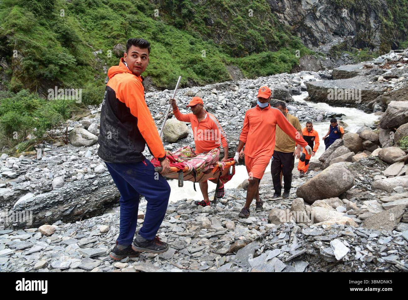 State Disaster Response Force (SDRF) personnel recover a dead body, a ...