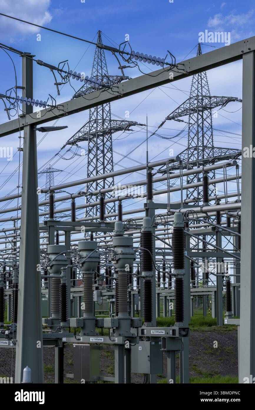 Power pylons with high-voltage lines and insulators at the Avacon ...