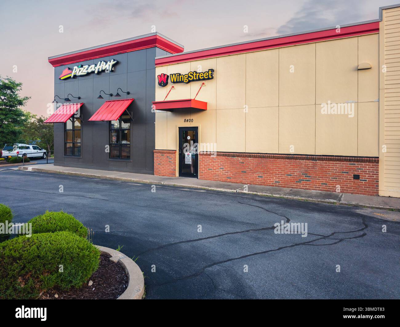 New Hartford, NY - Jun 25, 2025: Sunset view of Pizza Hut Restaurant, globally recognized fast ...
