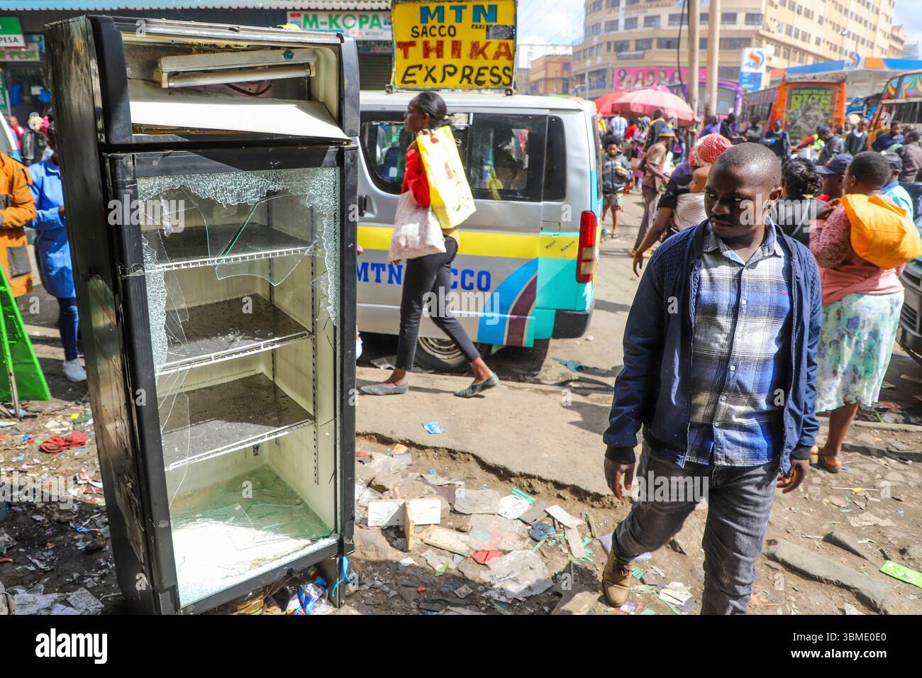 Business owners assess the damage to their vandalized merchandise and ...