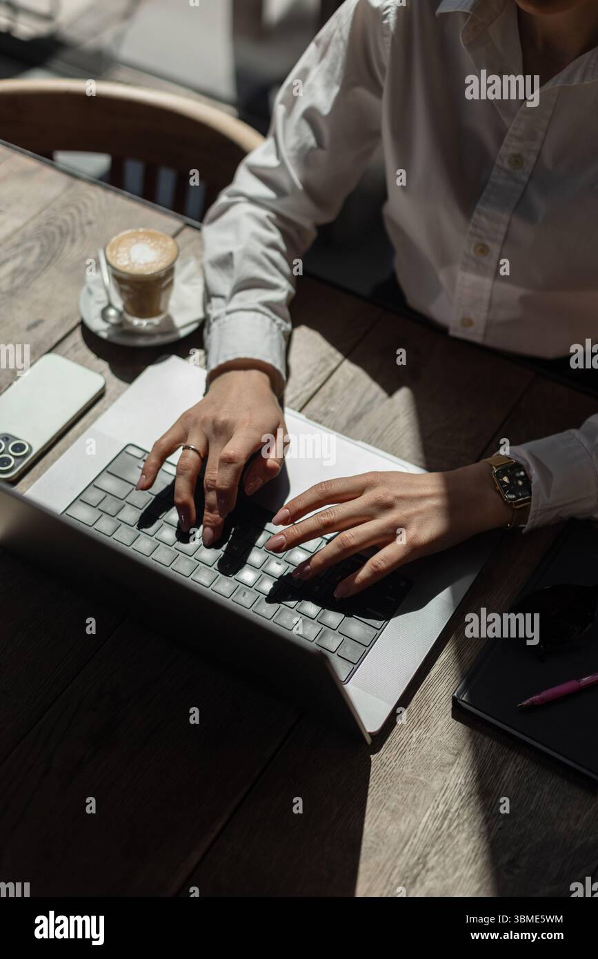 Freelancer Or Remote Worker Using Laptop At Wooden Desk. Daylight ...