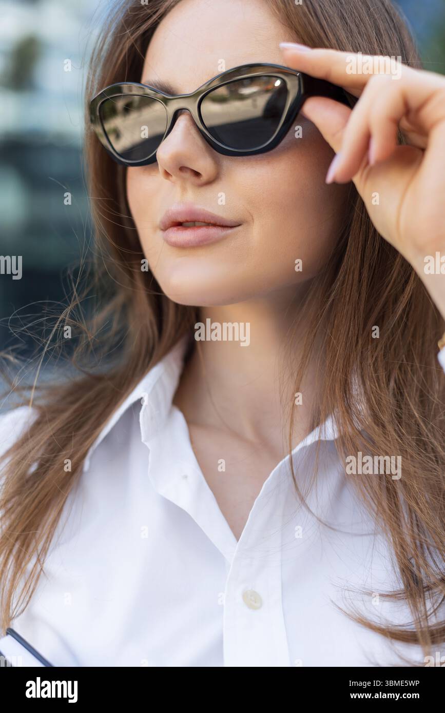 Confident Businesswoman Wears Fashion Sunglasses , Standing Outdoors In Front Of Modern Office ...