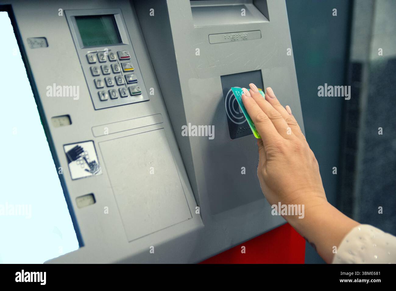 Woman using contactless payment at atm machine. Concept of inclusion ...