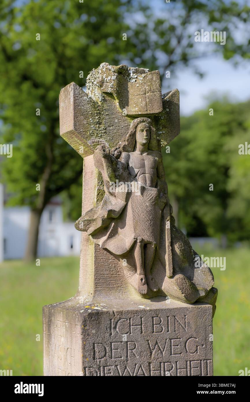 Stone sculpture of Jesus Christ with the biblical quotation I am the ...