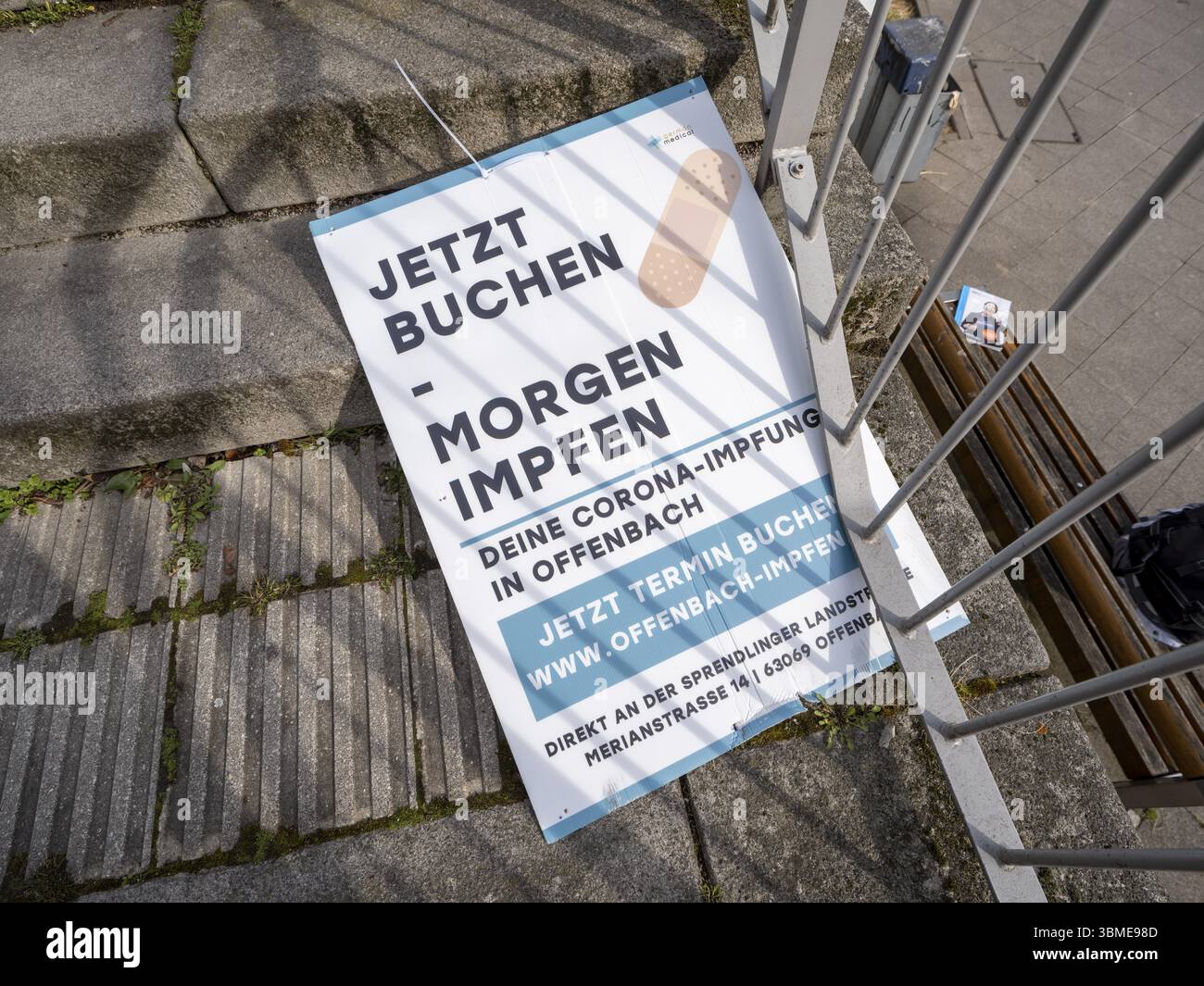Corona vaccination advertising poster lying on the ground, Offenbach am ...