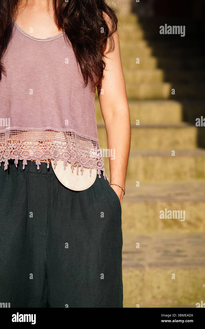Anonymous female with stoma standing in sunlight Stock Photo - Alamy