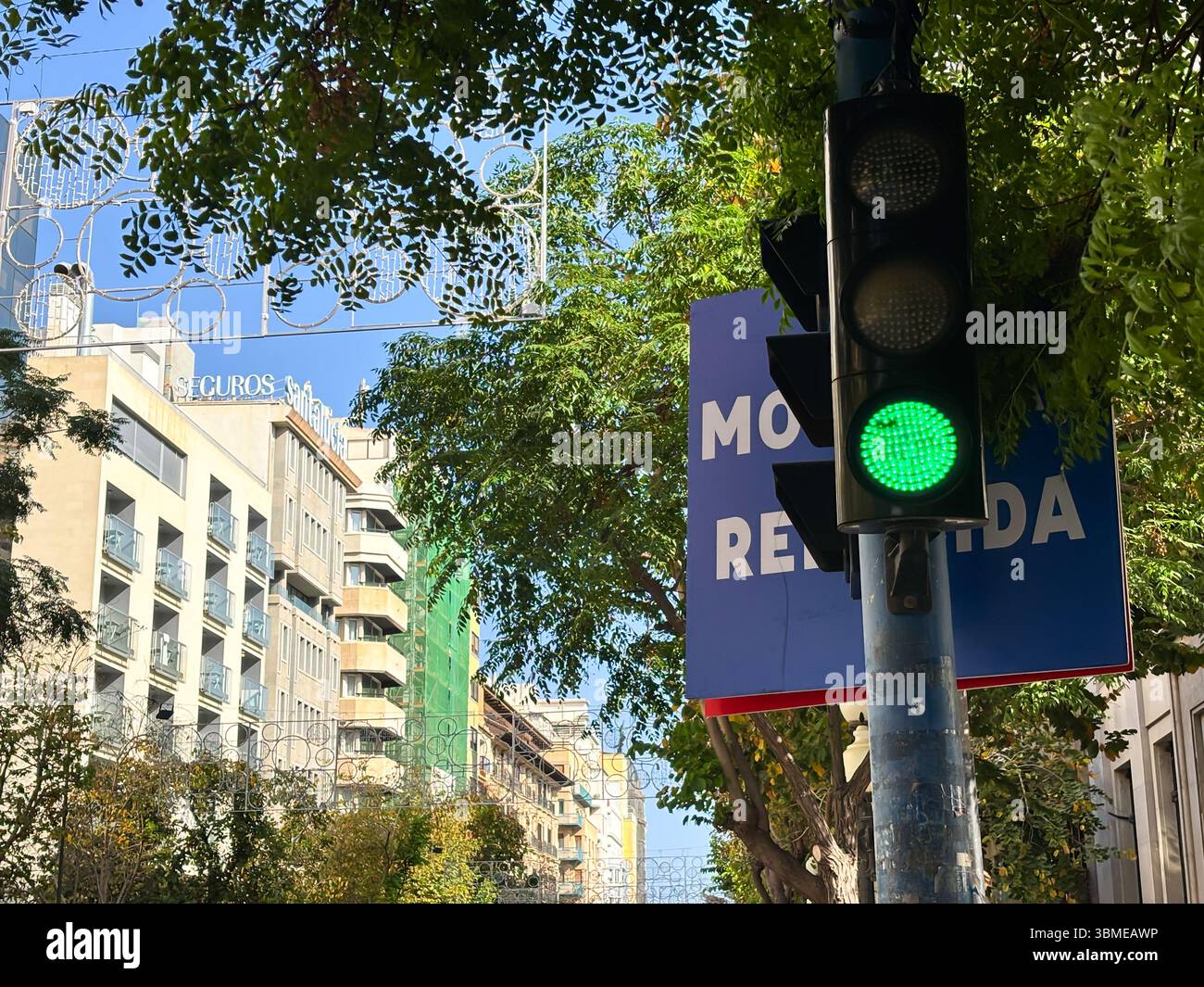 Alicante, Spain - June 24, 2025: Green traffic light signaling safe ...