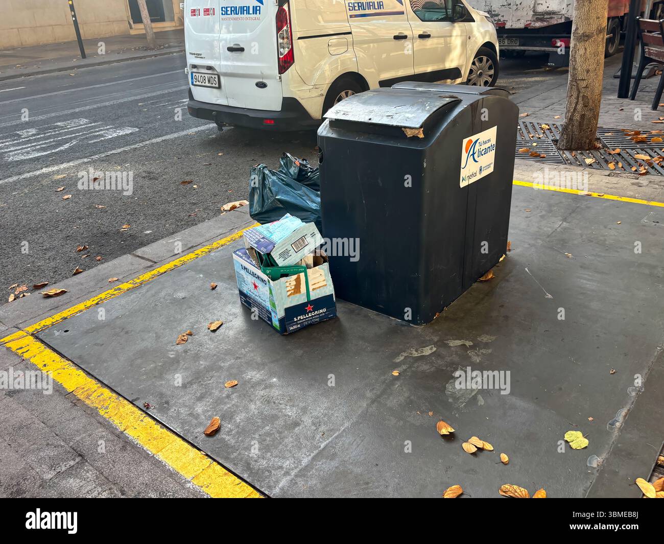 Alicante, Spain - June 24, 2025: Urban waste disposal scene featuring a ...