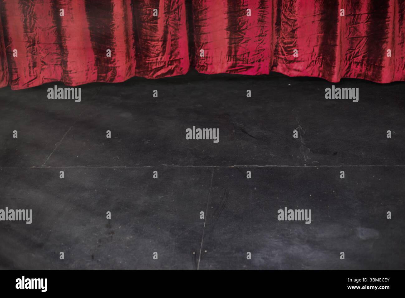 Grand stage with red curtains background. Closed theatre curtain before ...