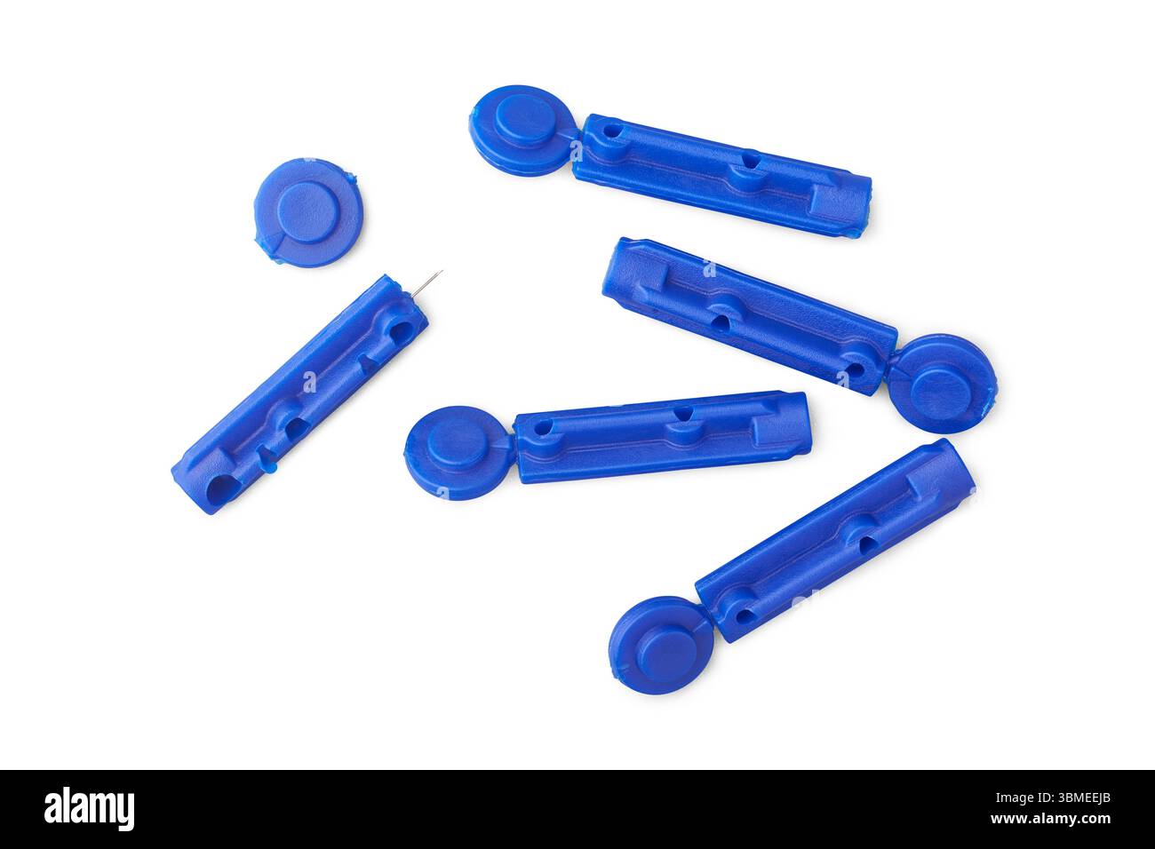 close-up of disposable blood sugar testing lancets with protective cap ...