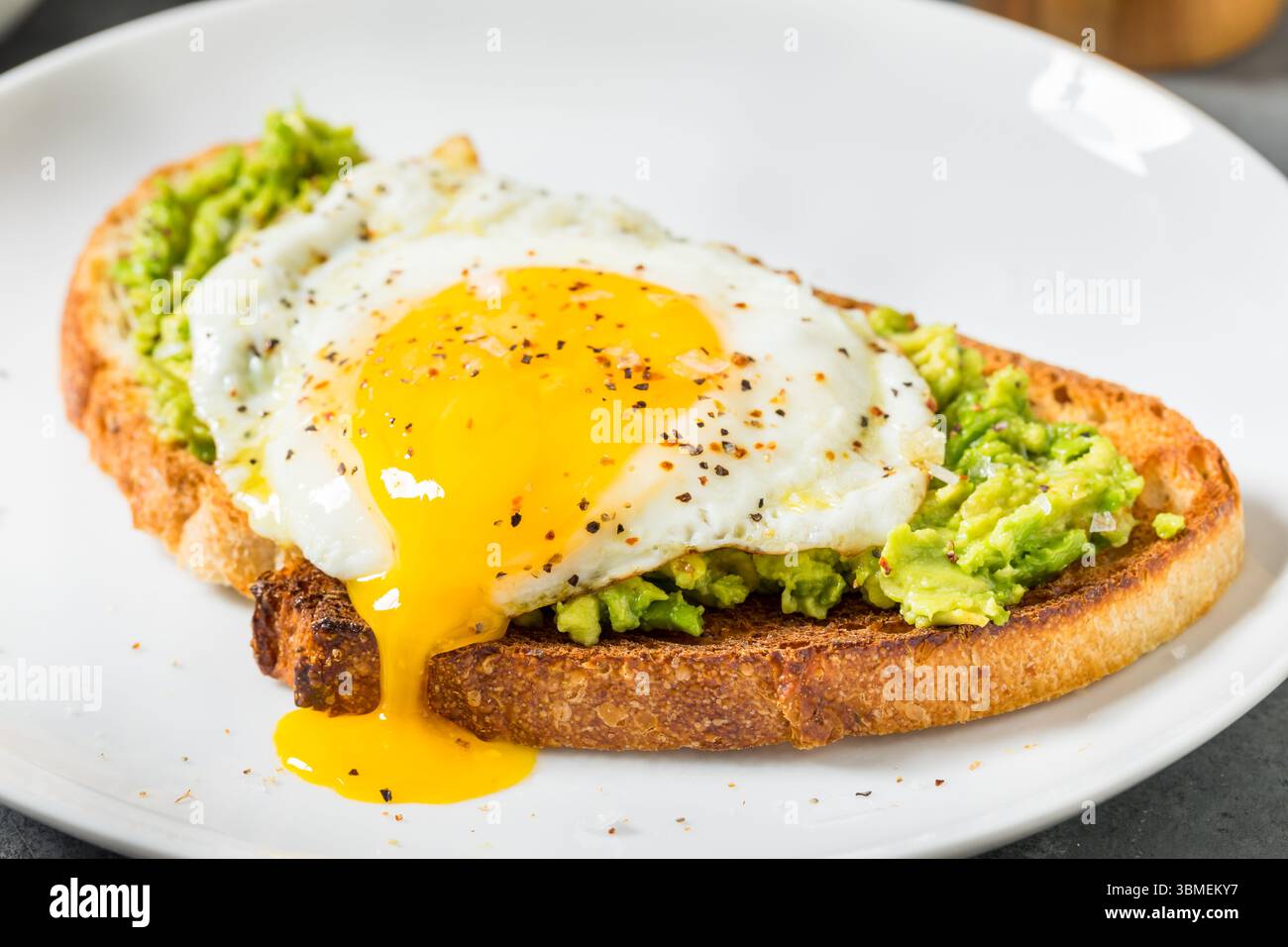 Healthy Homemade Avocado Toast with Over Easy Egg for Breakfast Stock ...