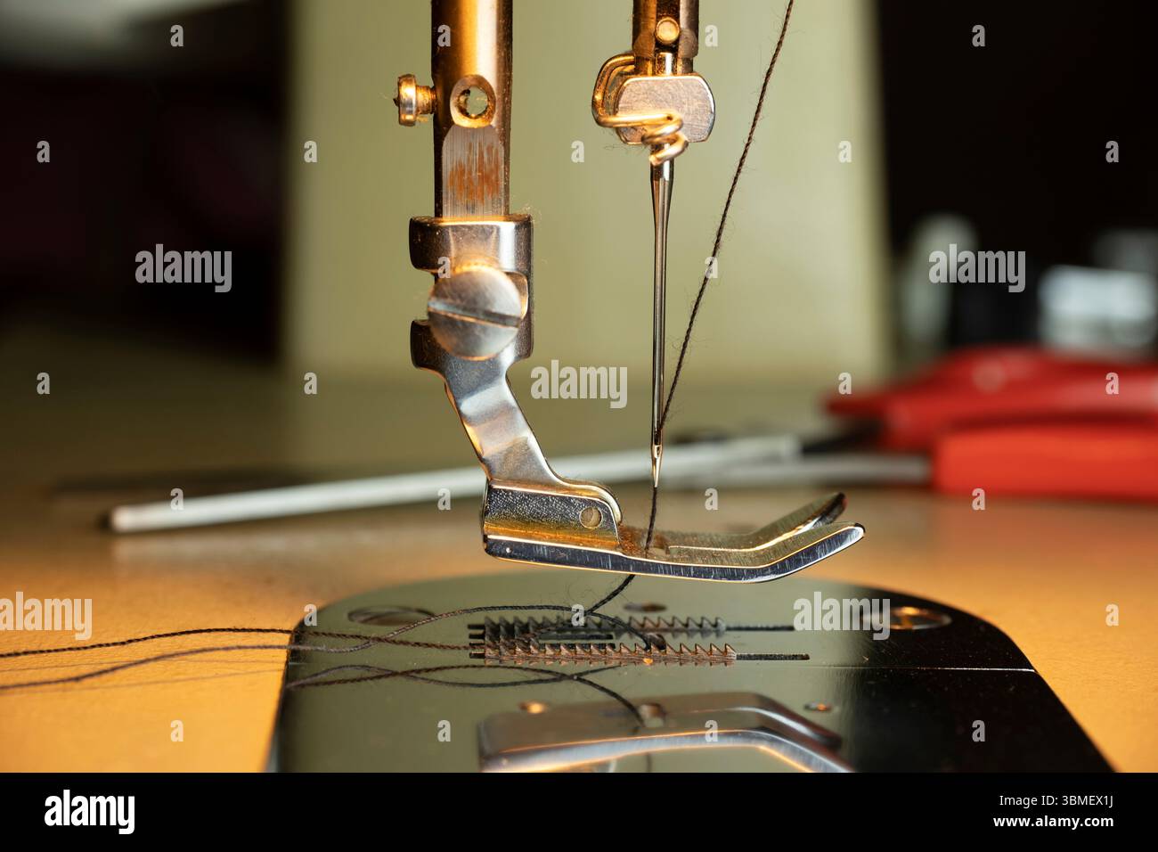 Old sewing machine, needle and thread Stock Photo - Alamy