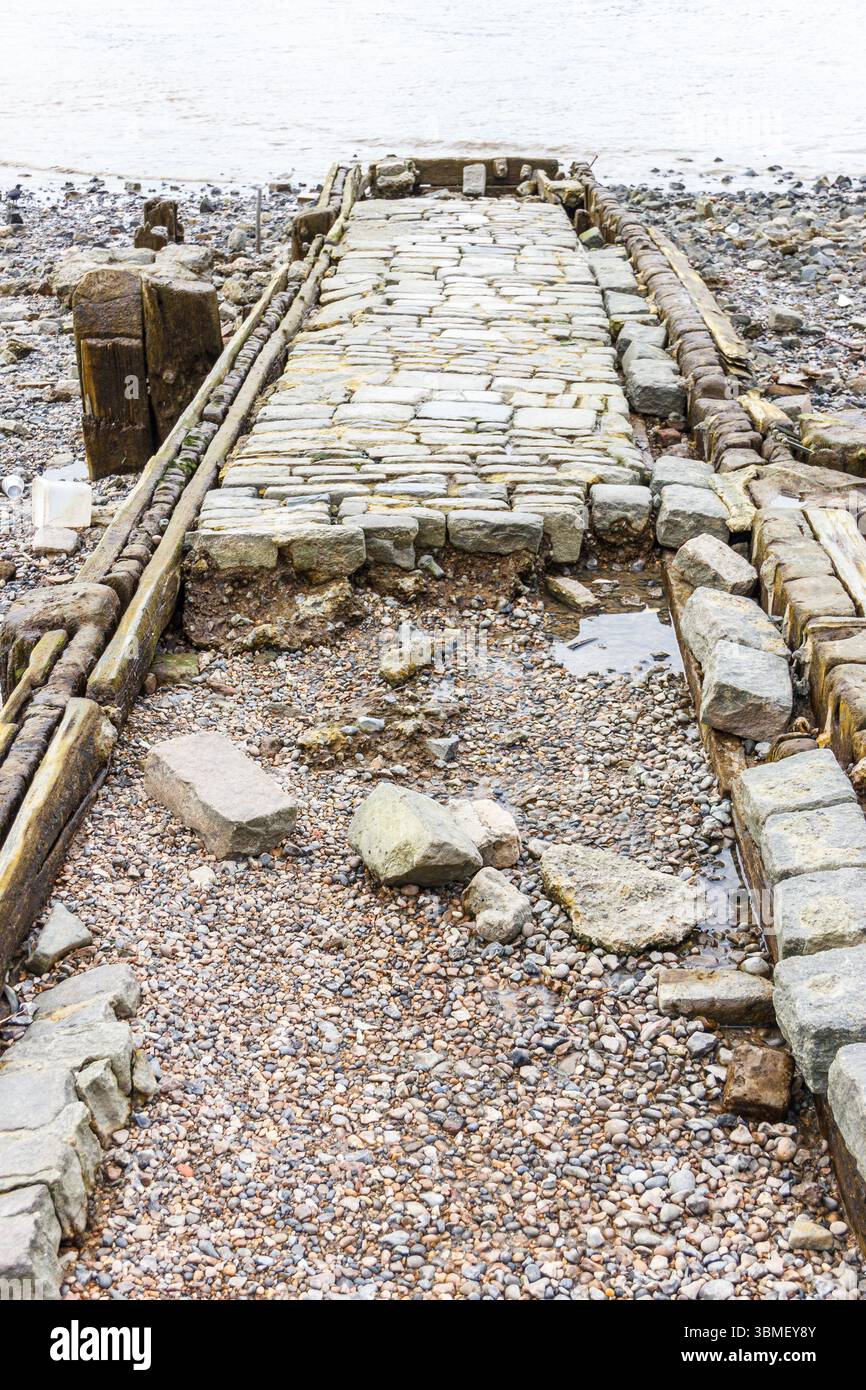 An old cobbled slipway on the south shore of the River Thames near ...