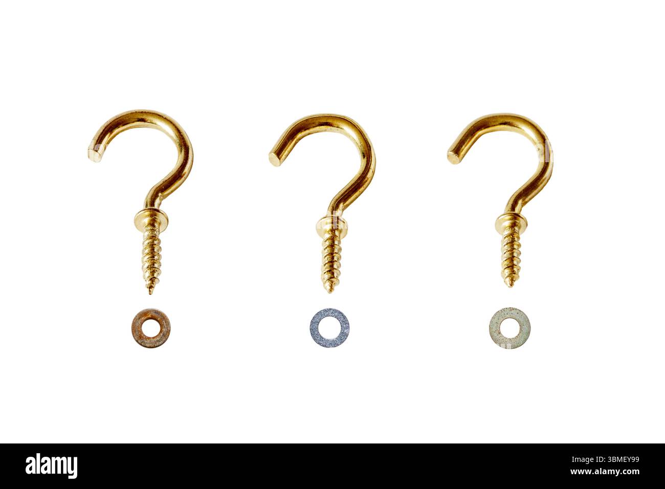 Concept image of a DIY question—three gold-coloured brass screw hooks ...