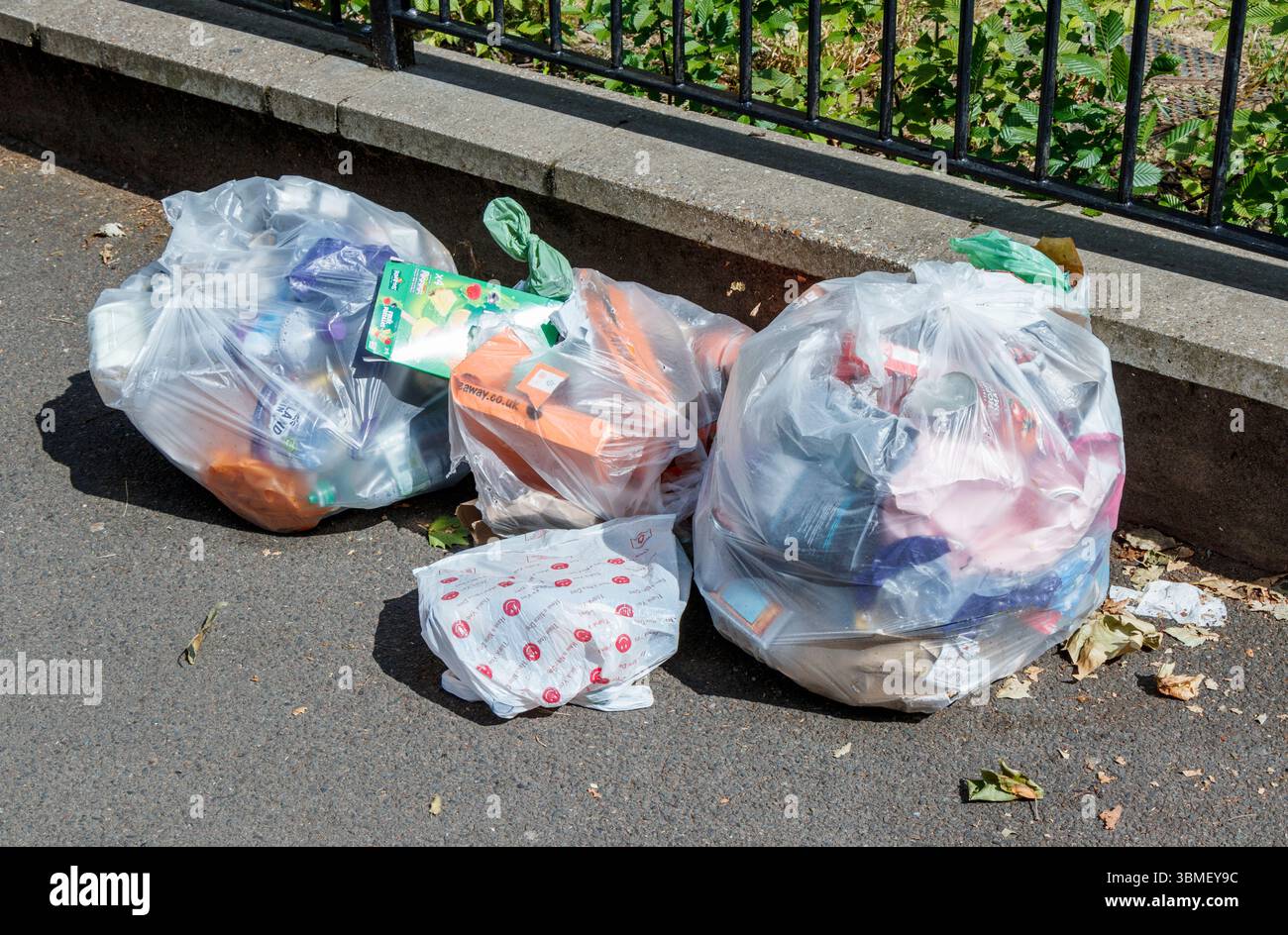 Plastic bags of rubbish dumped on the street, London, UK Stock Photo ...