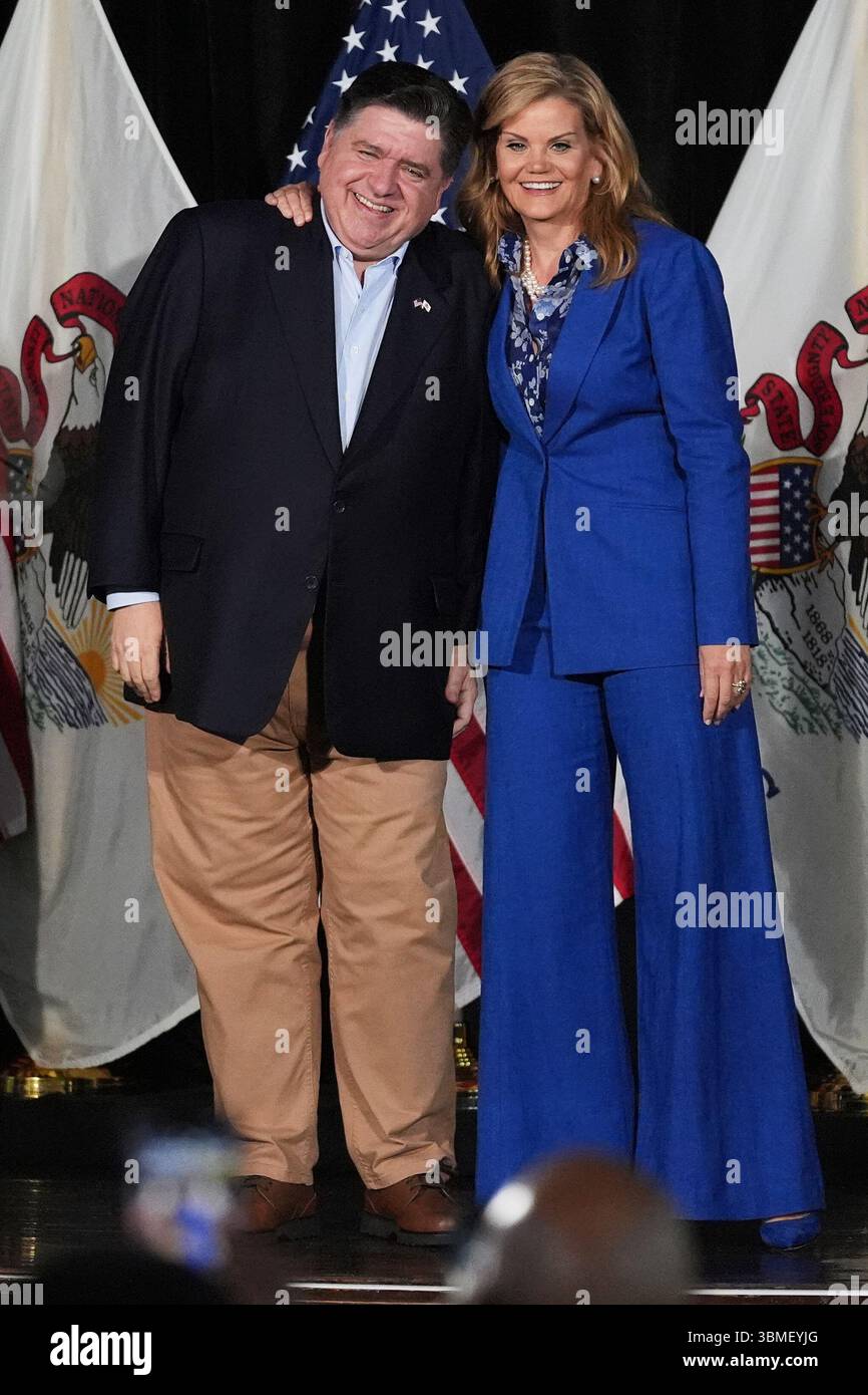 Illinois Governor JB Pritzker, left, greets supporters as he enters the ...