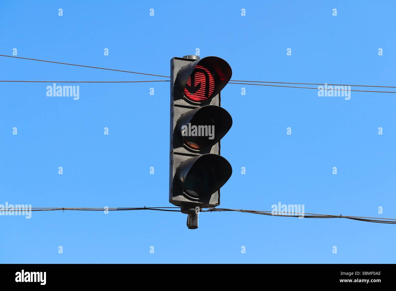 Red traffic light for U-turn suspended with wires. No U-turn signal ...