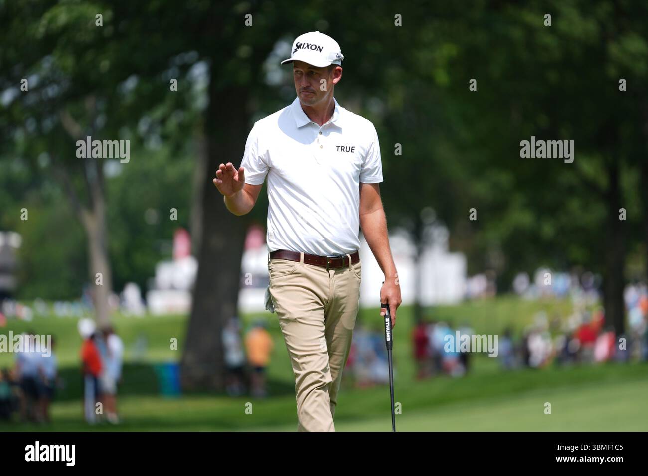 Andrew Putnam waves after his birdie putt on the eighth hole during the ...