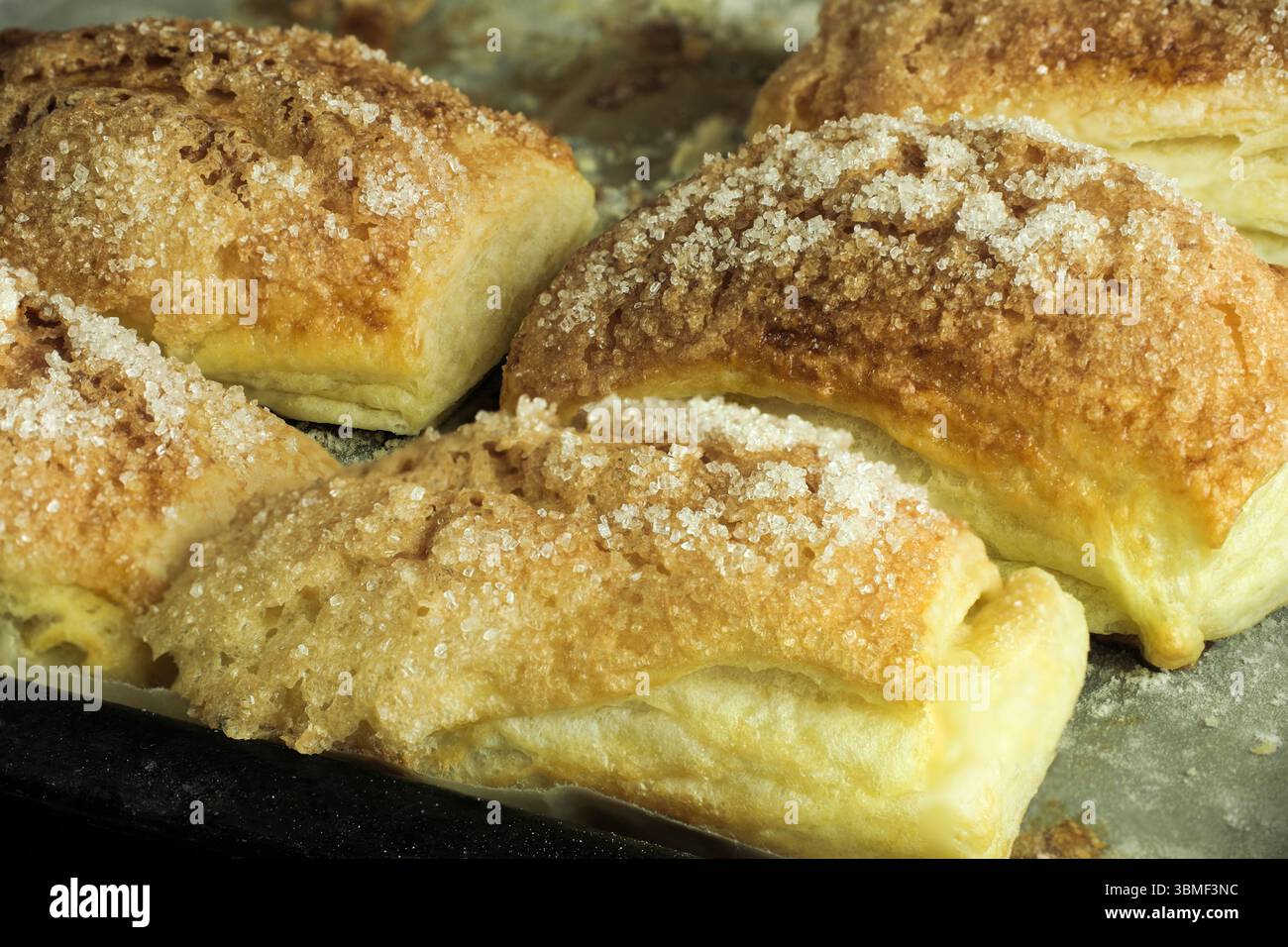 Folded baked puff pastry pies portions, top view Stock Photo - Alamy