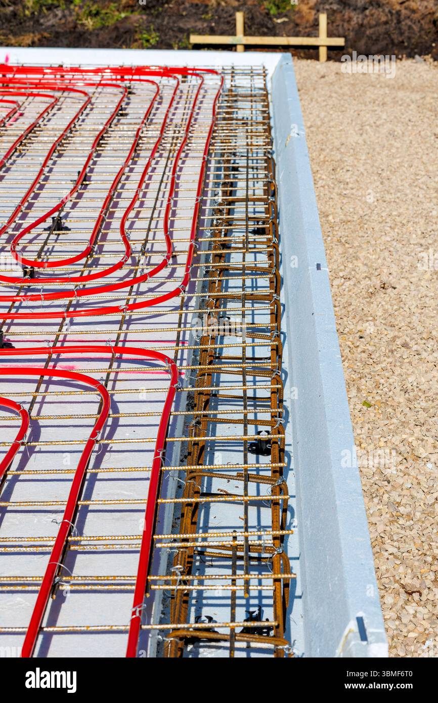 Underfloor heating system with red pipes on construction site Stock ...