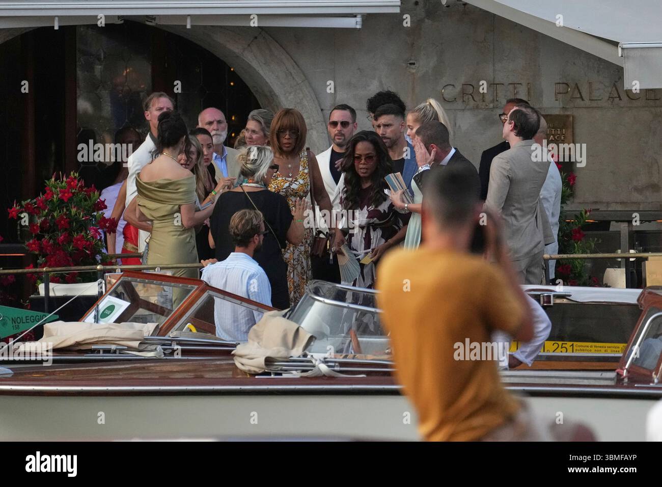 Oprah Winfrey, center right, and Gayle King, center left, leave a hotel ...