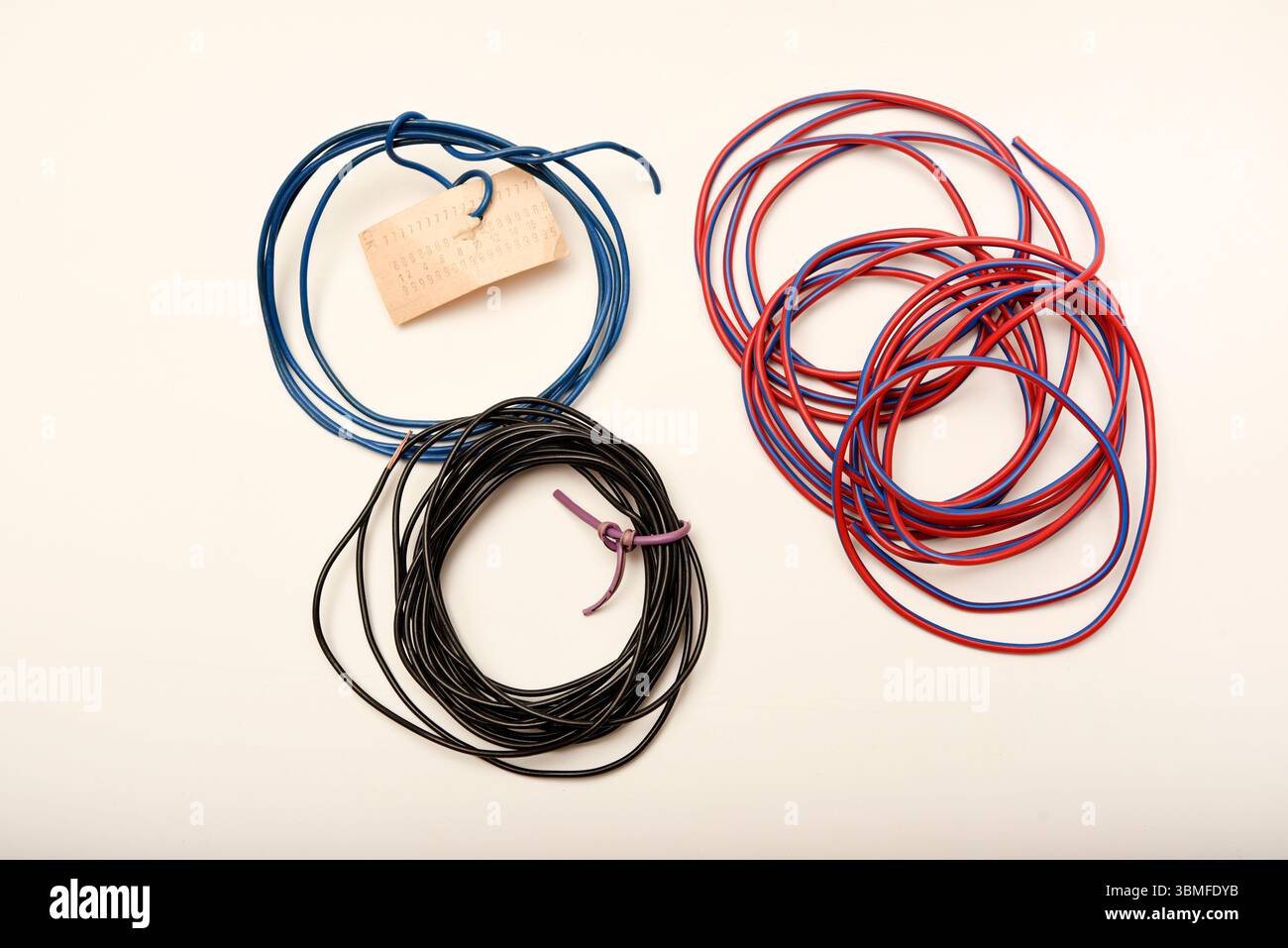 Bundles of copper connecting wires in rubber insulation. Multicolored ...
