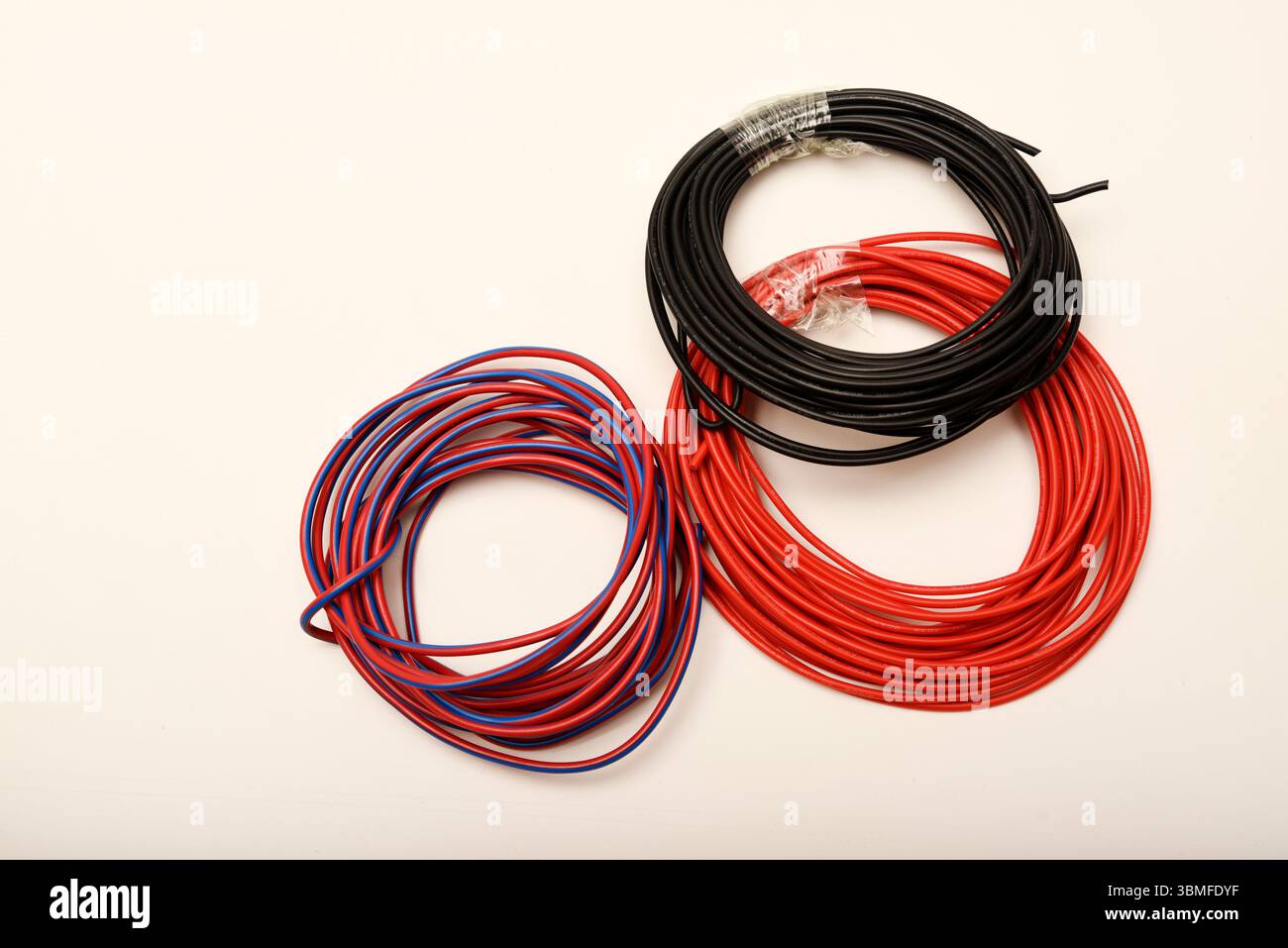 Bundles of copper connecting wires in rubber insulation. Multicolored ...