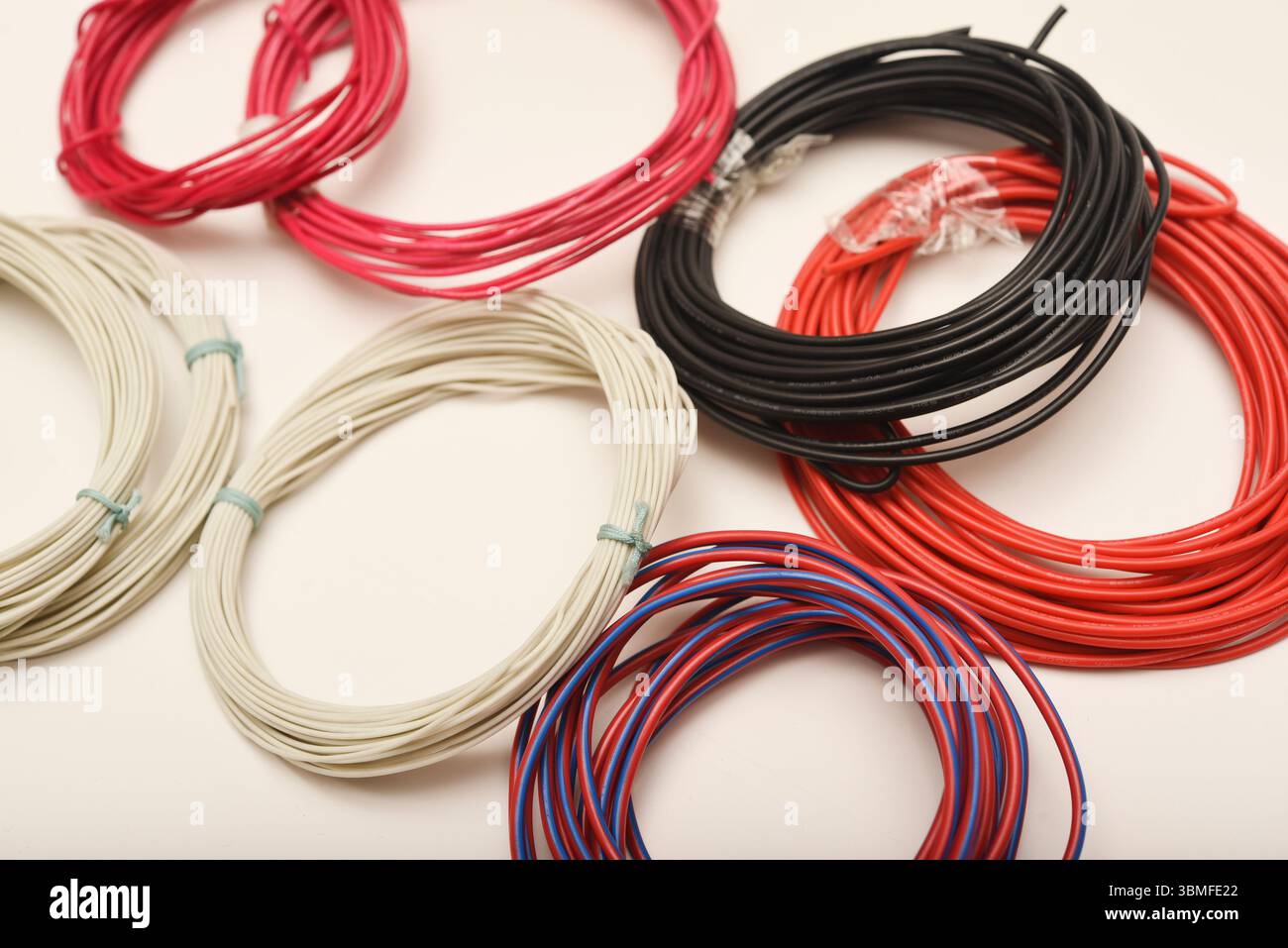 Bundles of copper connecting wires in rubber insulation. Multicolored ...