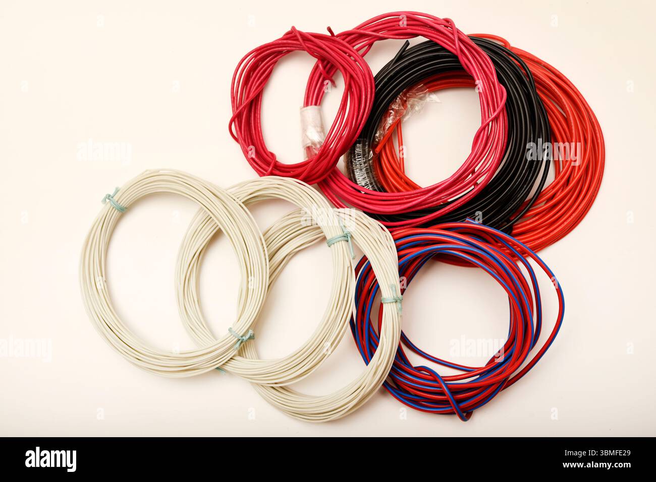 Bundles of copper connecting wires in rubber insulation. Multicolored ...
