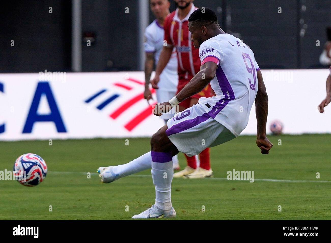 Al Ain's Kodjo Fo-Doh Laba scores his team's first goal on a free kick ...