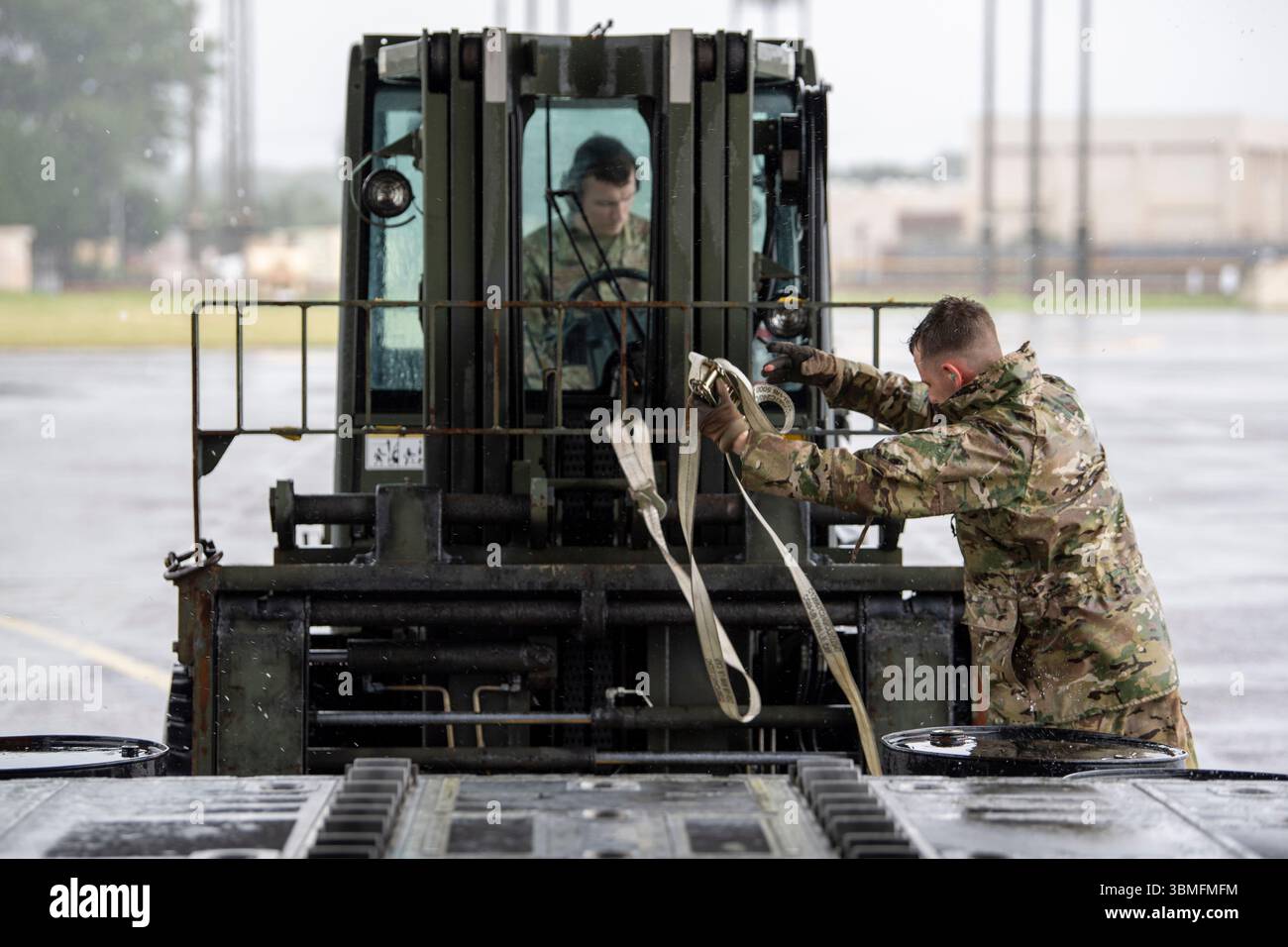 U.S. Air Force Senior Airman Gabriel Bundrick, left, 374th Logistics ...