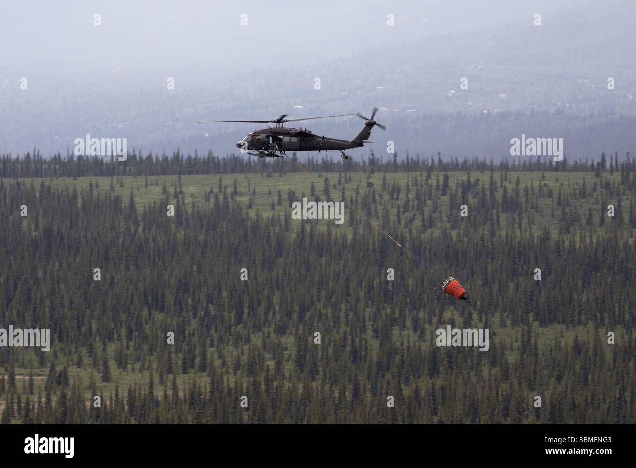 An Alaska Army National Guard UH-60L Black Hawk helicopter assigned to ...