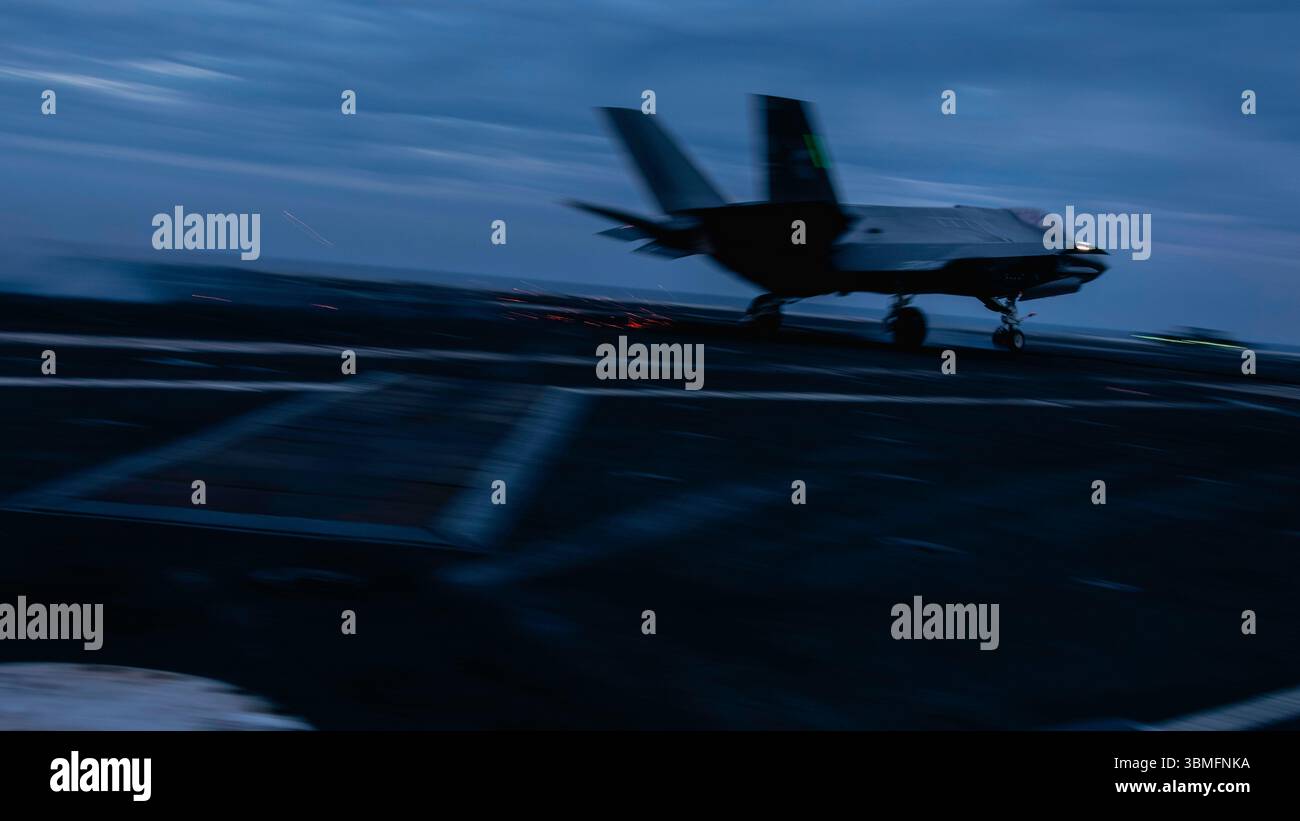 An F-35C Lightning II, attached to Strike Fighter Squadron (VFA) 147, lands on the flight deck ...