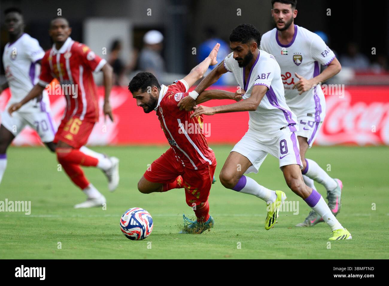Al Ain's Mohammed Abbas and Wydad AC's Ayoub Boucheta compete for the ...
