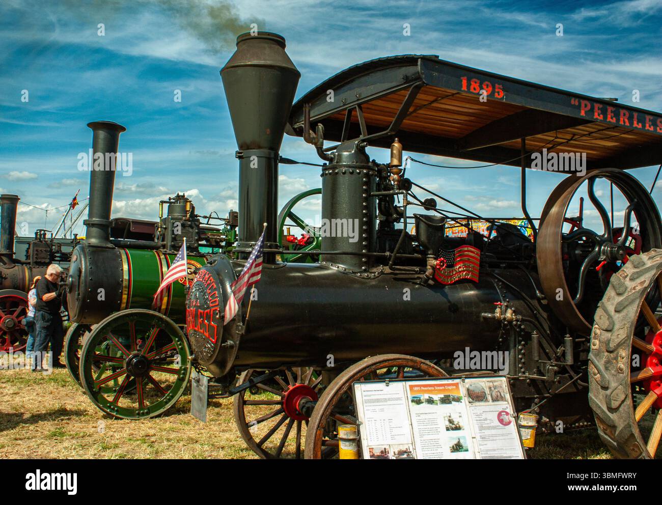 Vintage steam traction engines on display at a public festival with ...