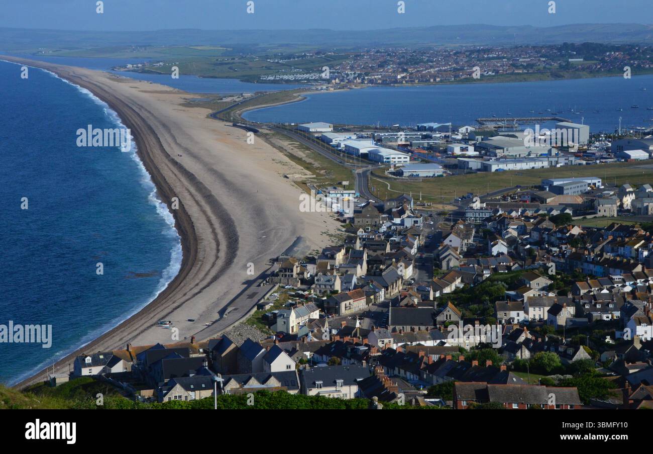 Aerial view of Chesil Beach and the town of Portland in Dorset, England ...