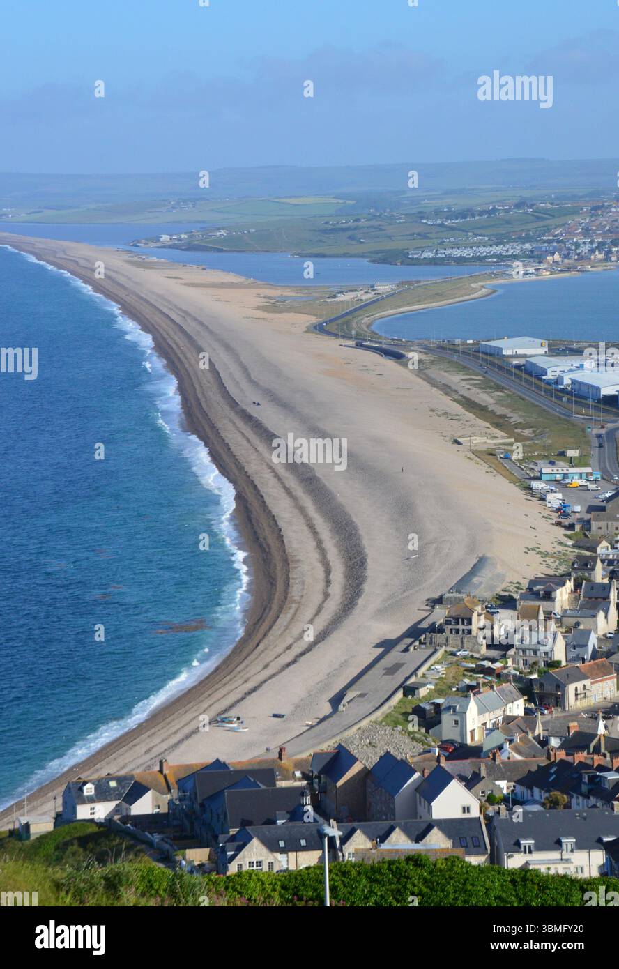 Aerial view of Chesil Beach and the town of Portland in Dorset, England ...