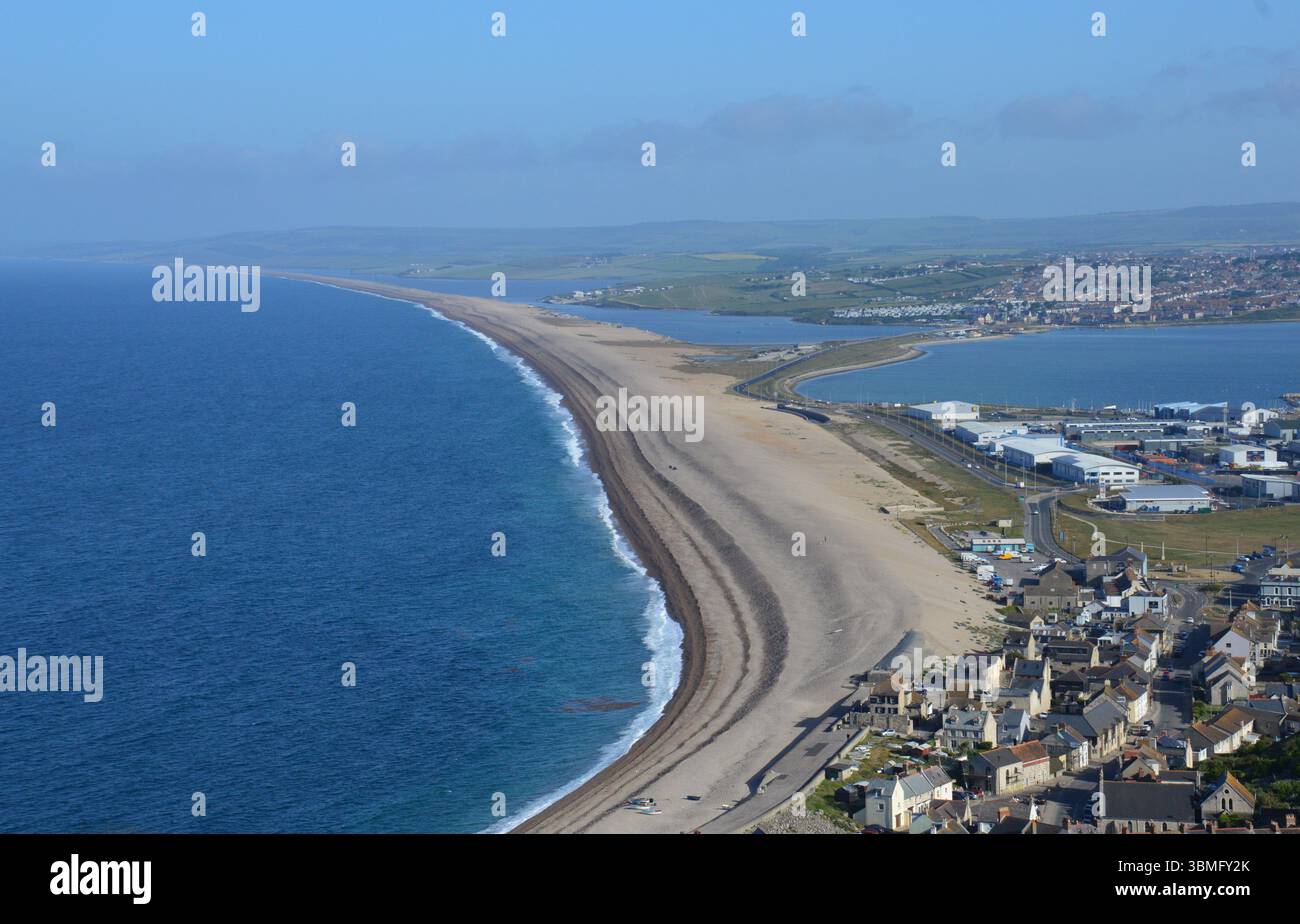 Aerial view of Chesil Beach and the town of Portland in Dorset, England ...