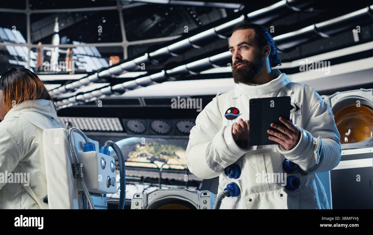 Astronaut reading mission plan hi-res stock photography and images - Alamy