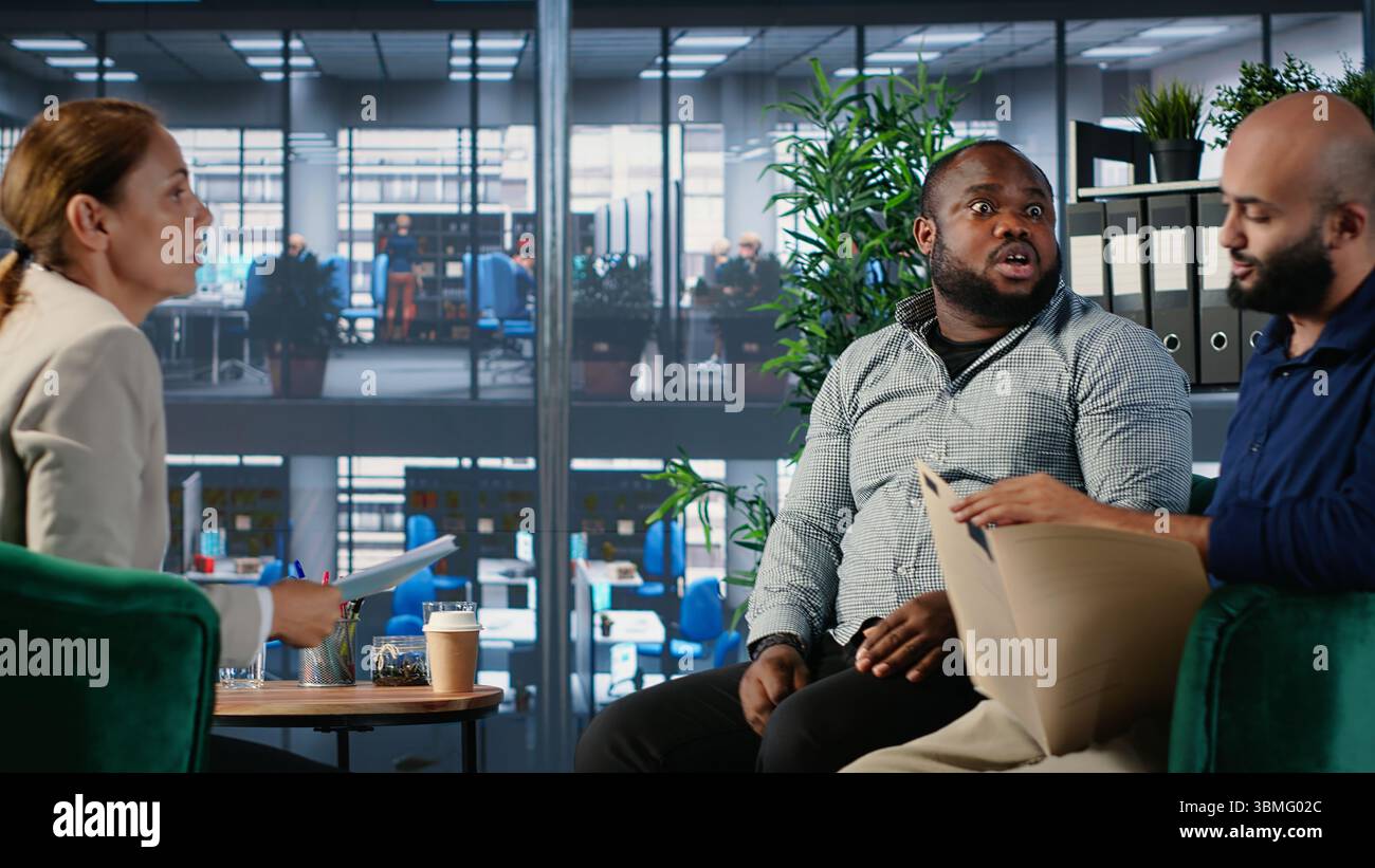 Multiethnic professionals in heated argument hi-res stock photography ...