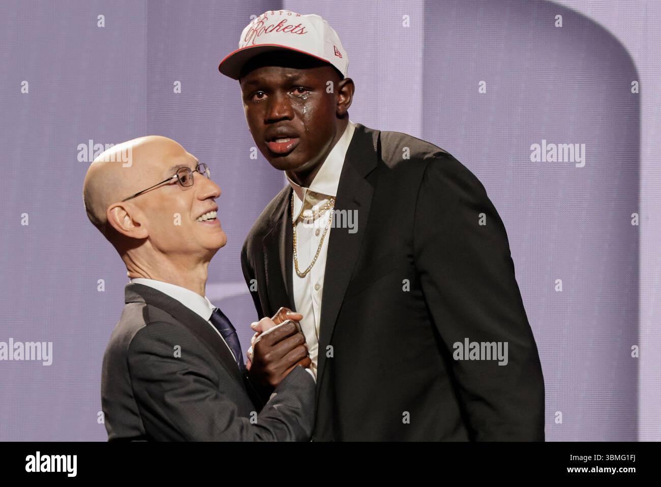 Khaman Maluach reacts as he greets NBA commissioner Adam Silver after ...