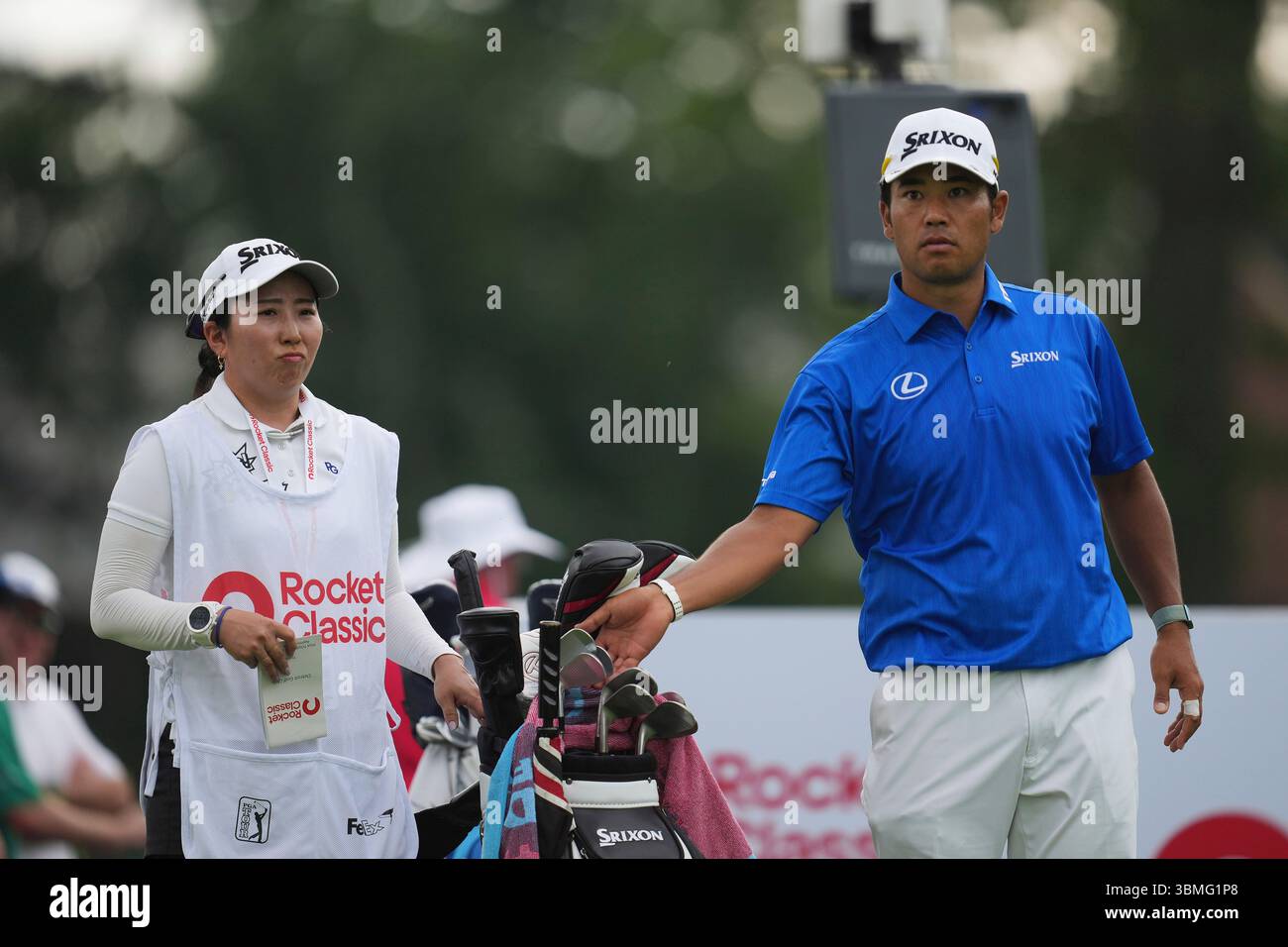 Hideki Matsuyama, of Japan, right, waits with his caddie Mei Inui at ...