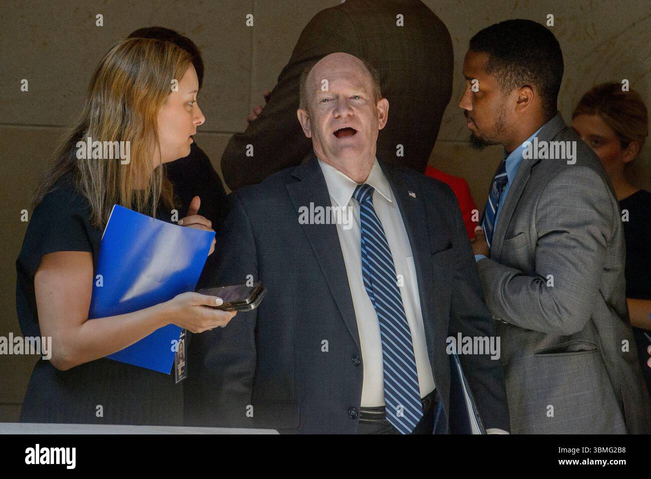 Sen. Chris Coons, D-Del., departs following a classified briefing on ...