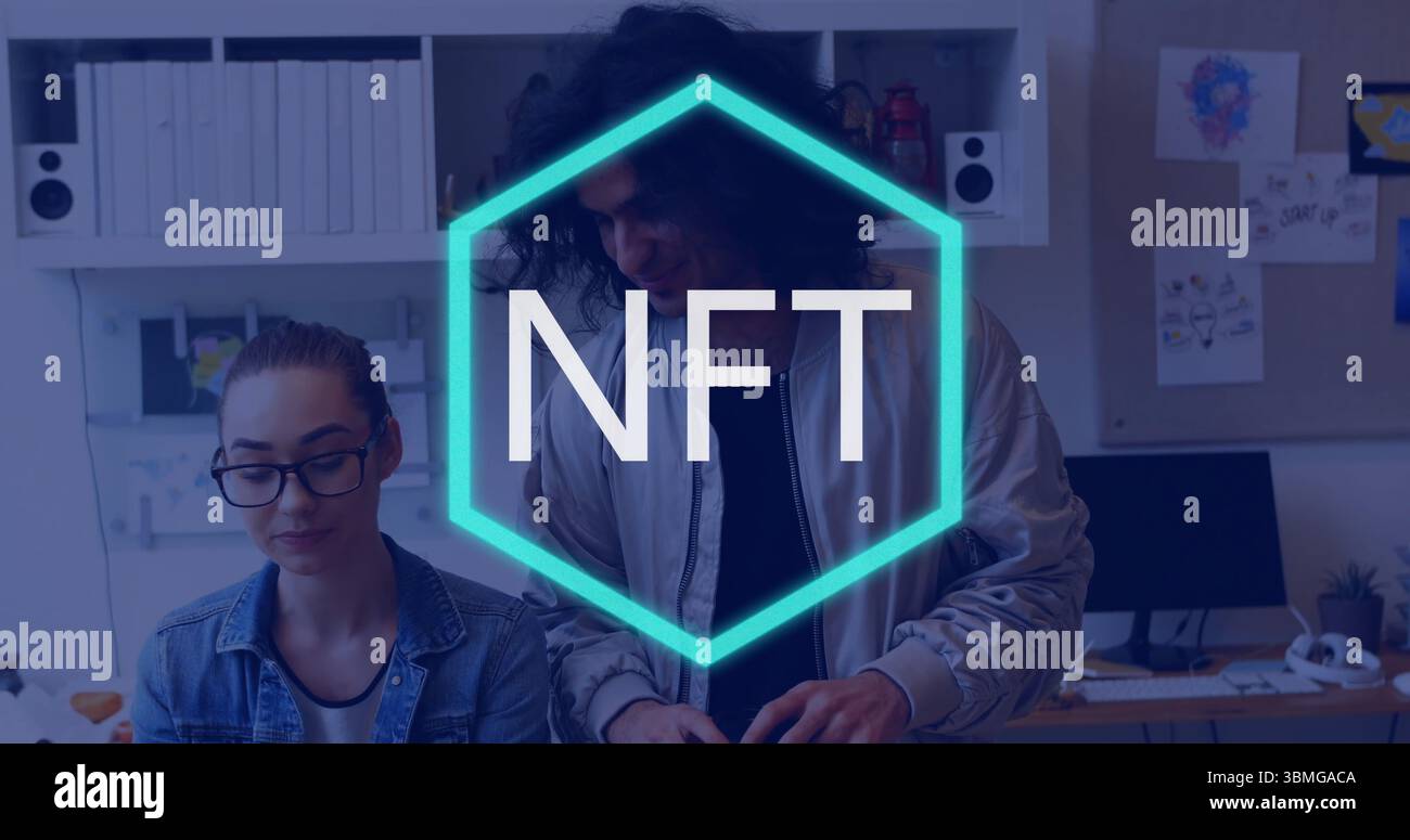 Collaborating colleagues examining screen at modern office desk, with ...